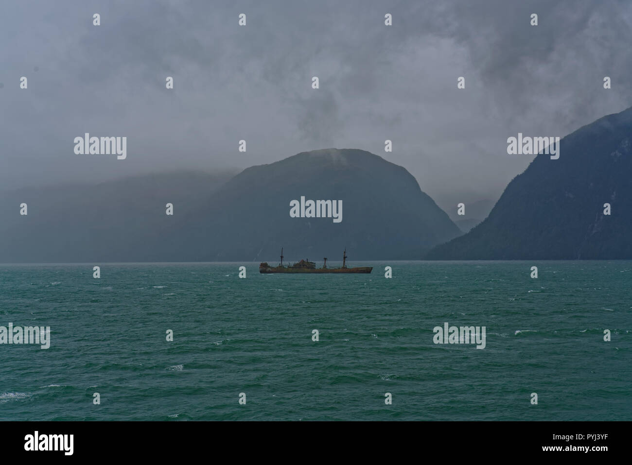 boat wrecked on the patagonian channels of chile Stock Photo - Alamy