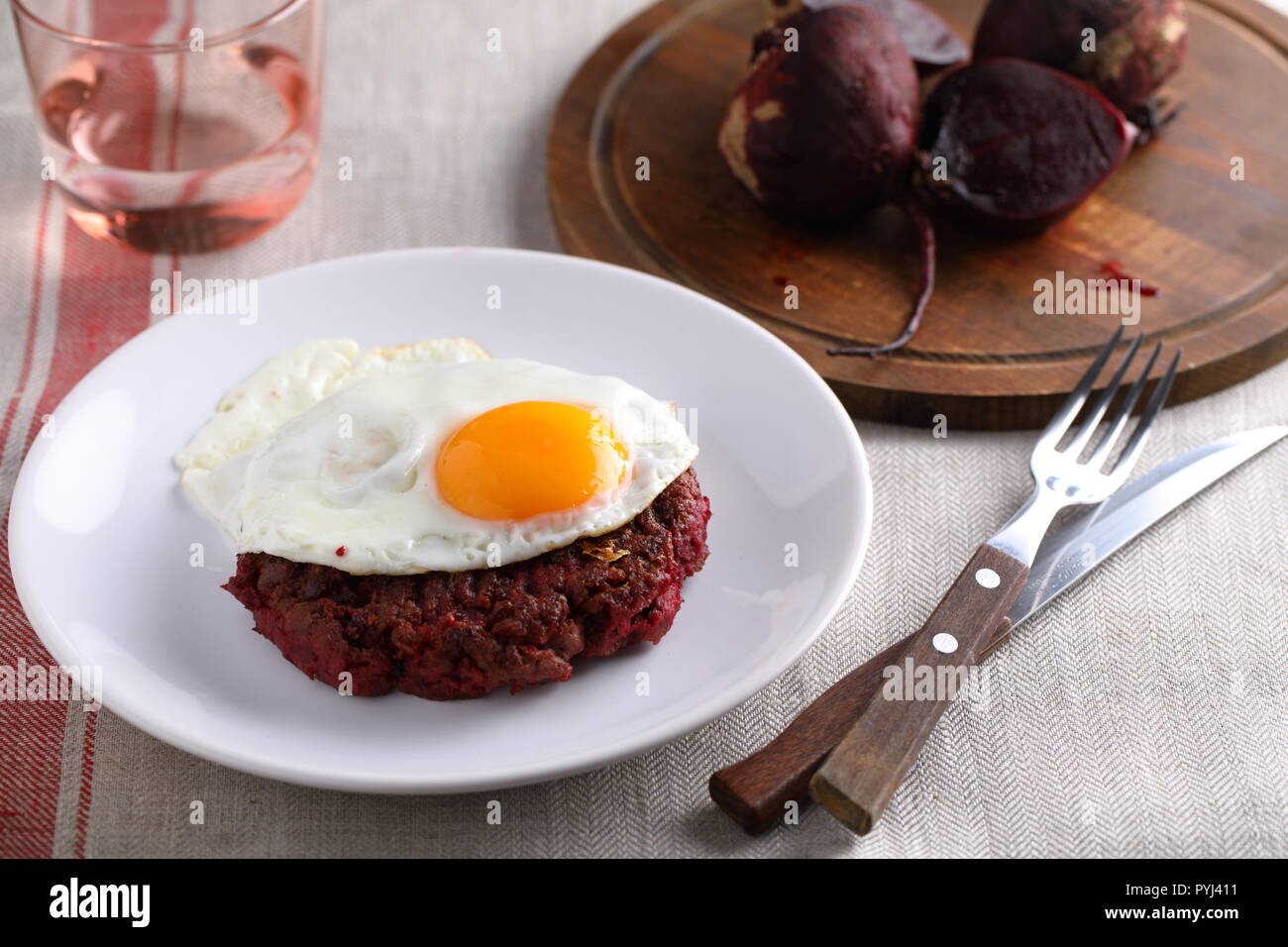 Swedish beef burger Biff a la Lindstrom with fried egg Stock Photo - Alamy