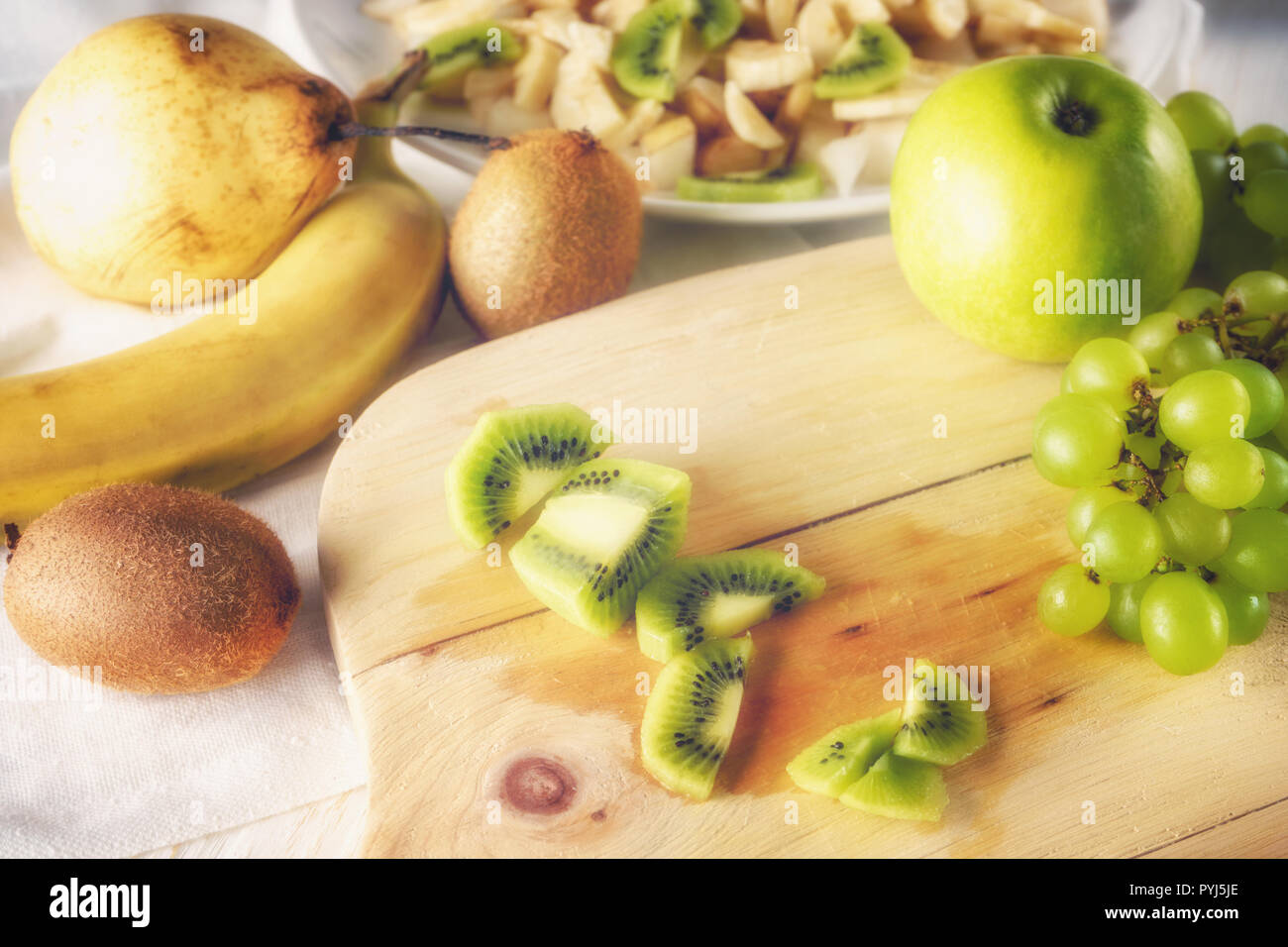 Cook cutting banana hi-res stock photography and images - Alamy