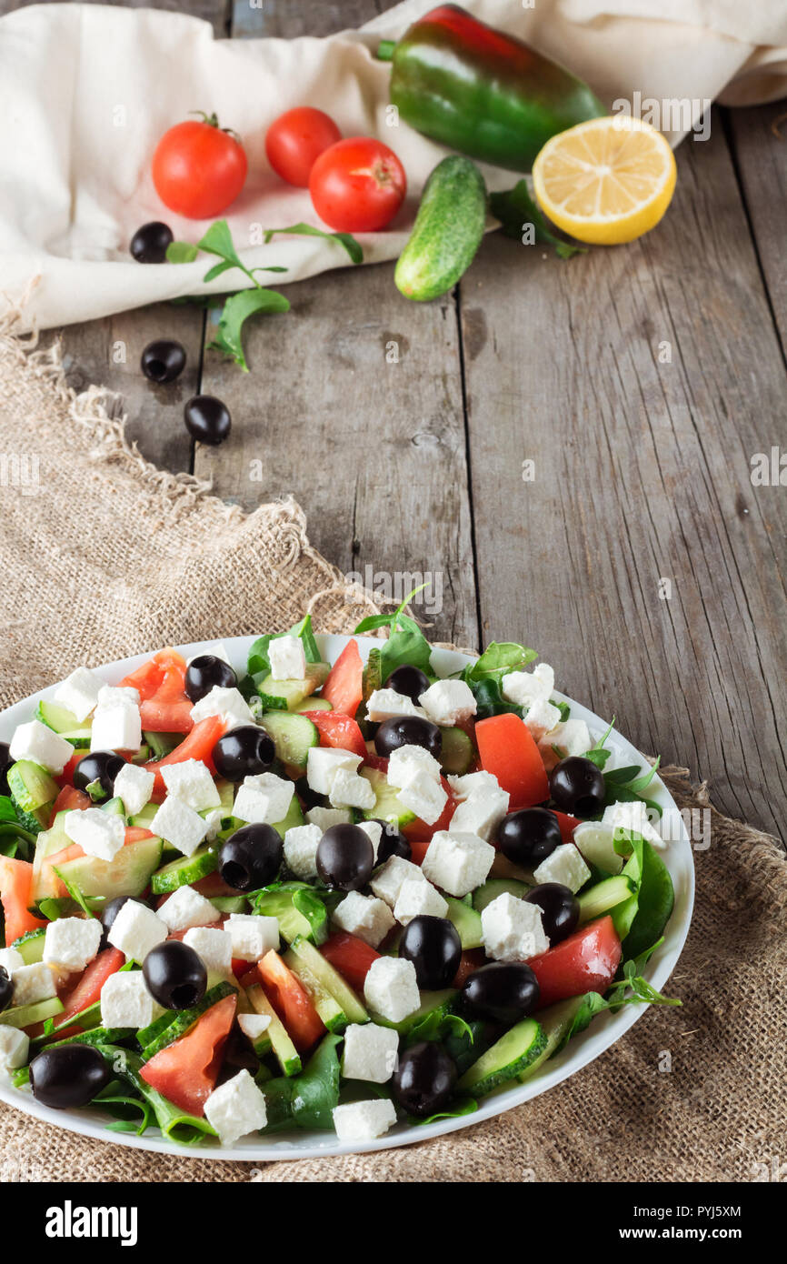 Greek salad closeup. Ingredients in background Stock Photo - Alamy