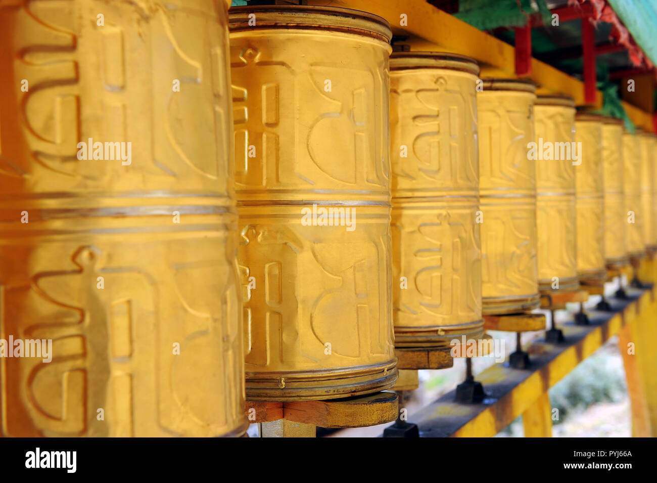Golden prayer wheel in Tibet Stock Photo - Alamy