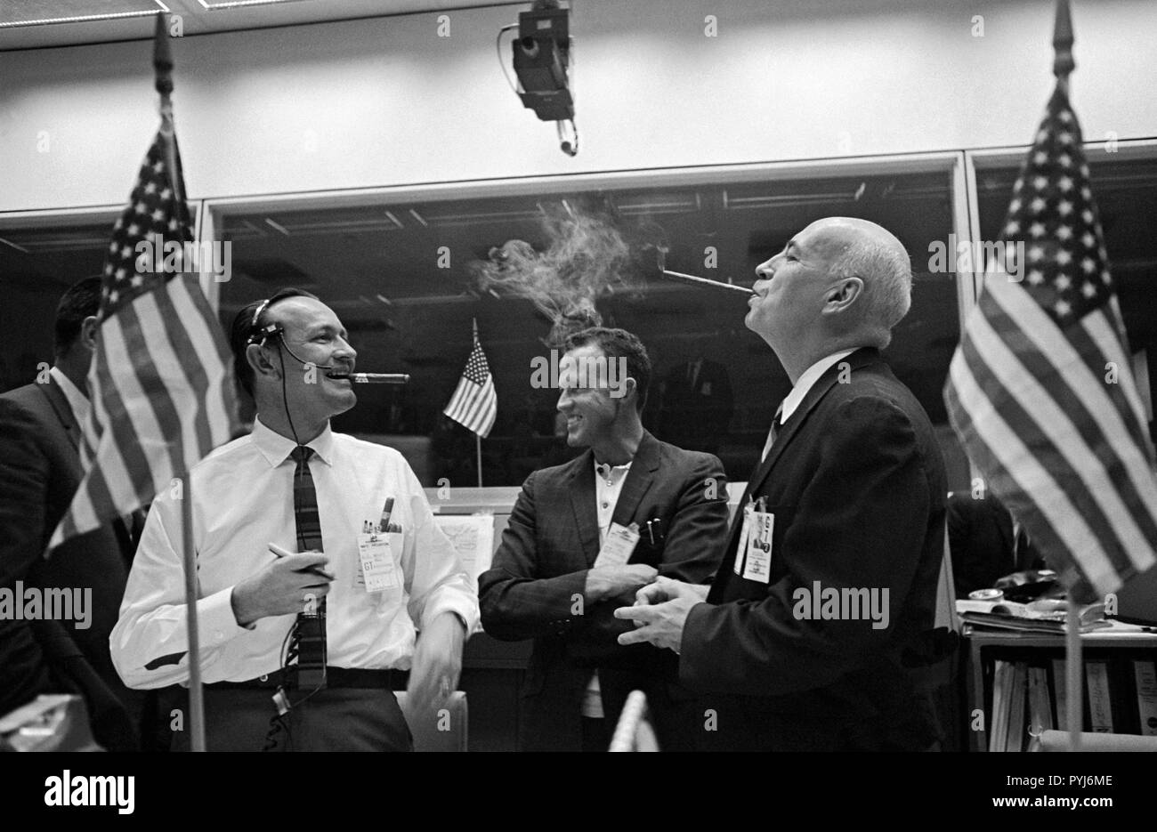 Christopher C. Kraft Jr. (left), red team flight director; astronaut L ...