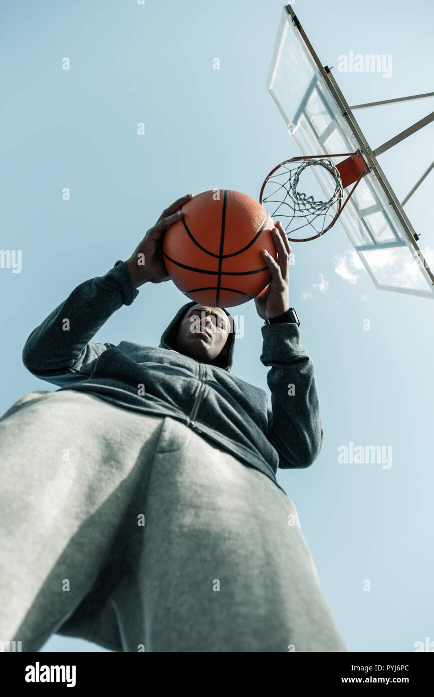 Low angle of an orange basketball ball Stock Photo - Alamy