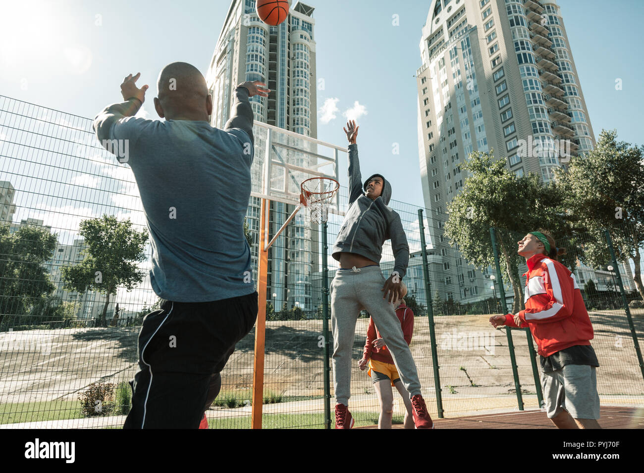 Trying to catch the ball hi-res stock photography and images - Alamy