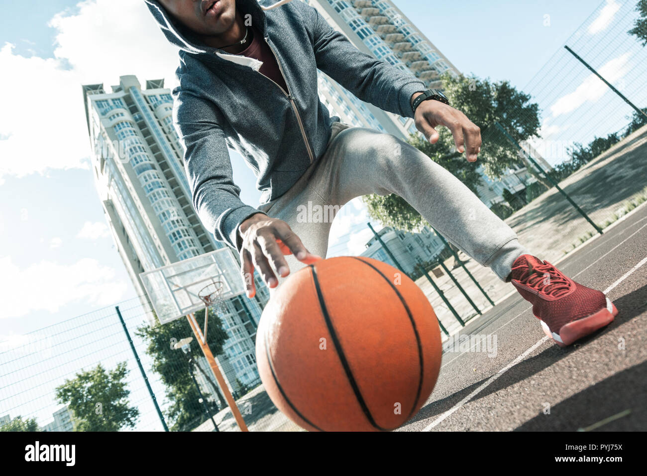 Orange basketball ball falling on the ground Stock Photo - Alamy