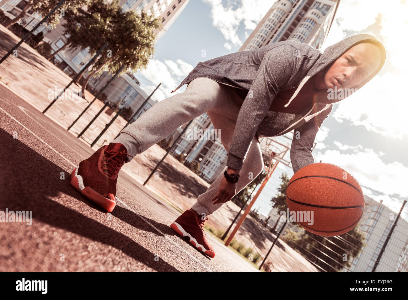 Low angle of a serious concentrated man Stock Photo - Alamy