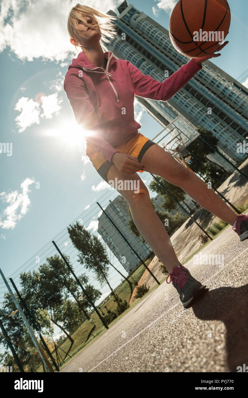 Low angle of a well built active woman Stock Photo - Alamy