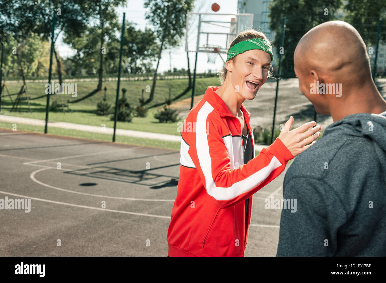 Happy cheerful man greeting his best friend Stock Photo - Alamy