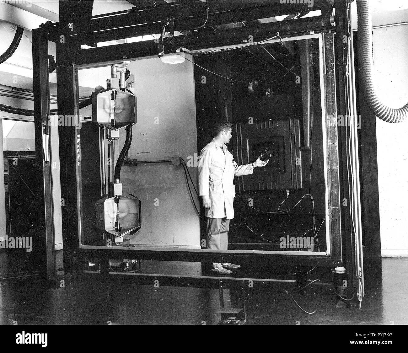Jay Prendergast adjusts the lens on a Robertson 48-inch, 4.5 ton camera ...
