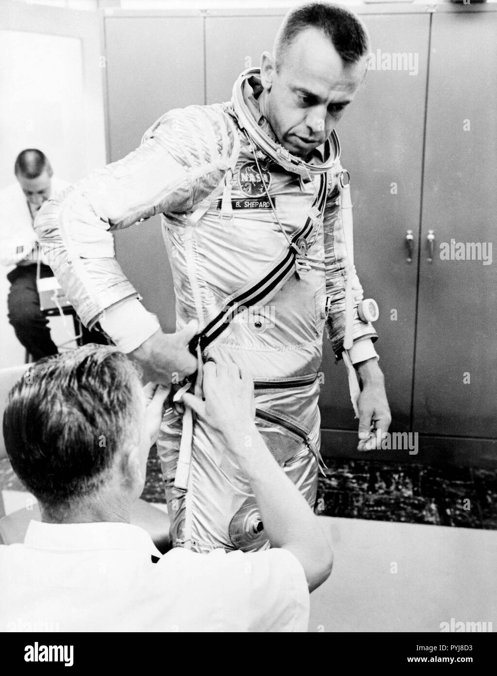 (5 May 1961) --- Astronaut Alan B. Shepard Jr. is being helped into his ...