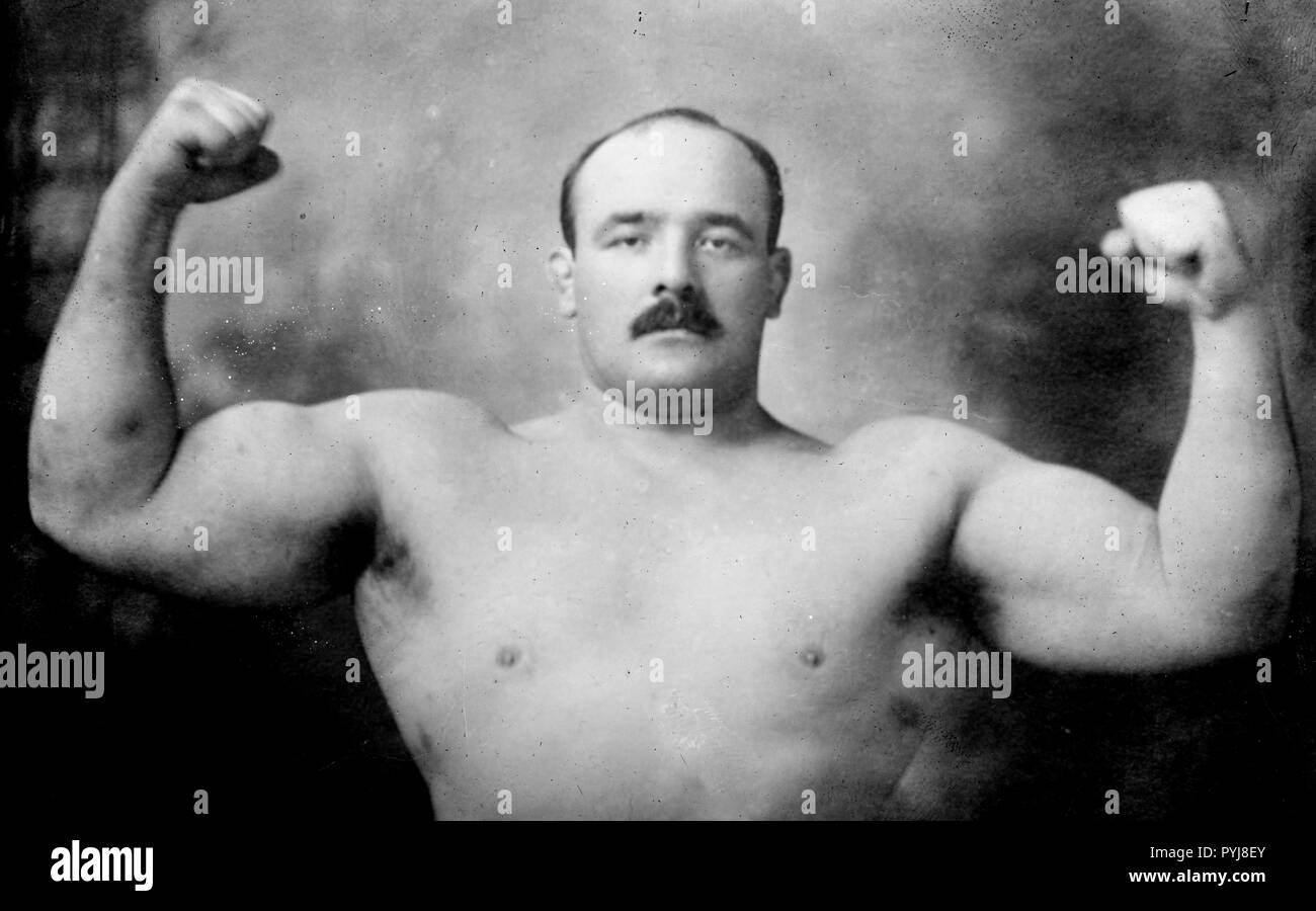 Flexing Muscles Black and White Stock Photos & Images - Alamy