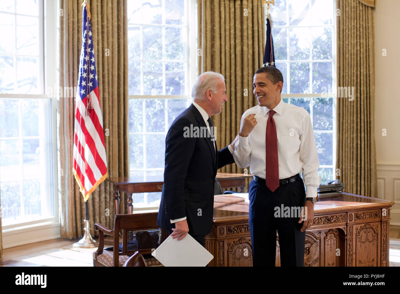 President Barack Obama and Vice President Joe Biden laugh together in ...