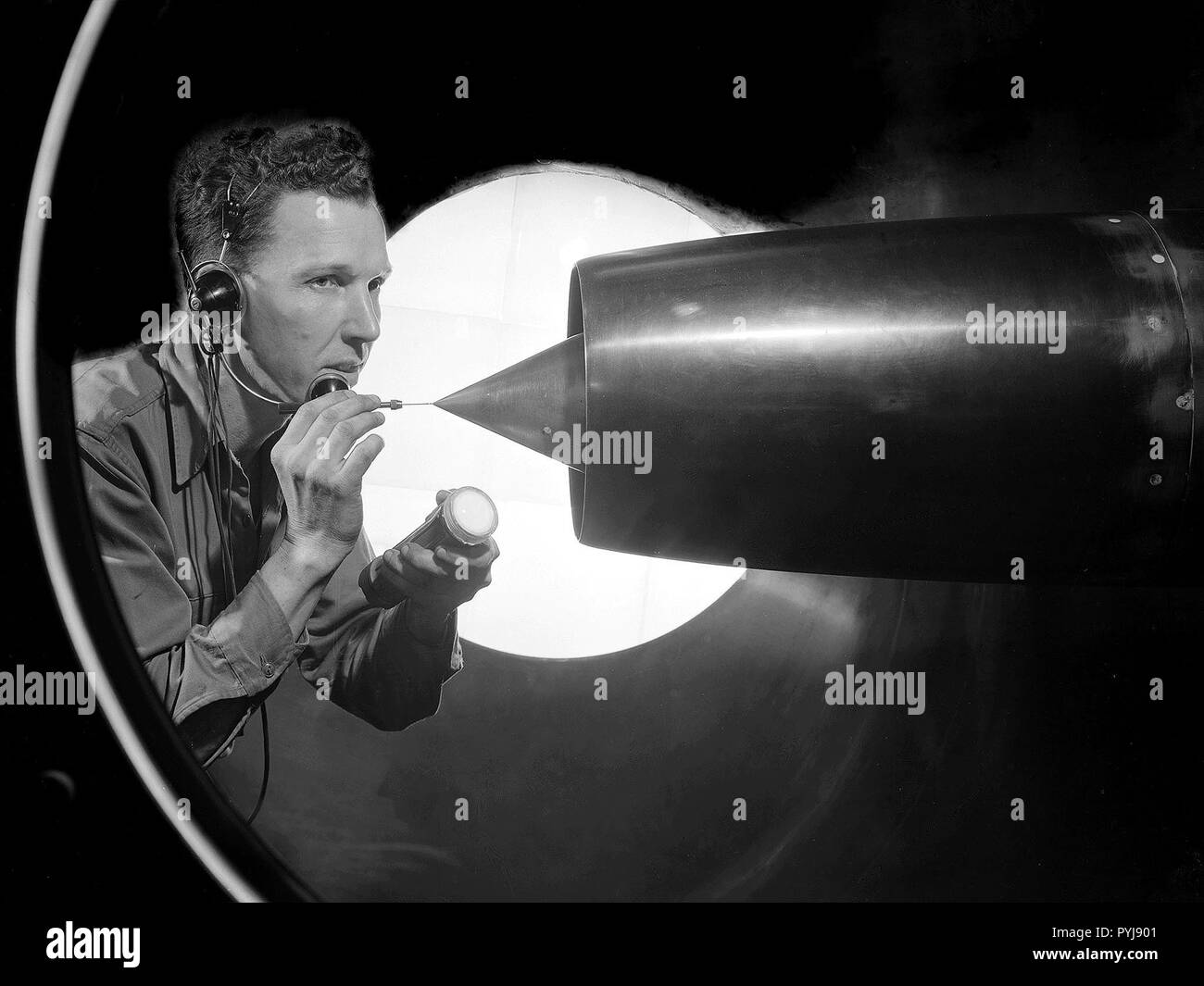 A technician at the National Advisory Committee for Aeronautics (NACA ...
