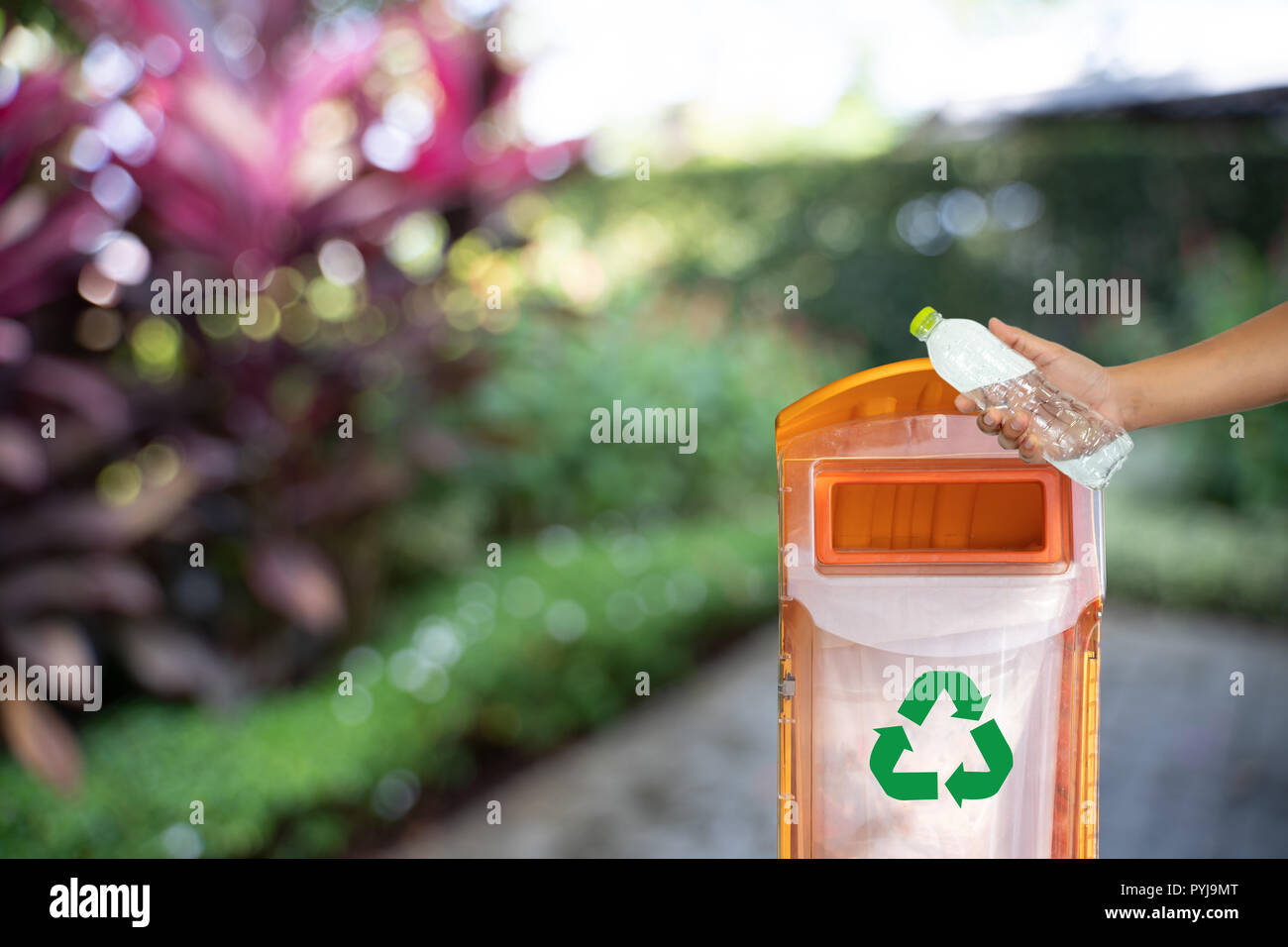 man hand putting plastic reuse for recycling concept environmental ...