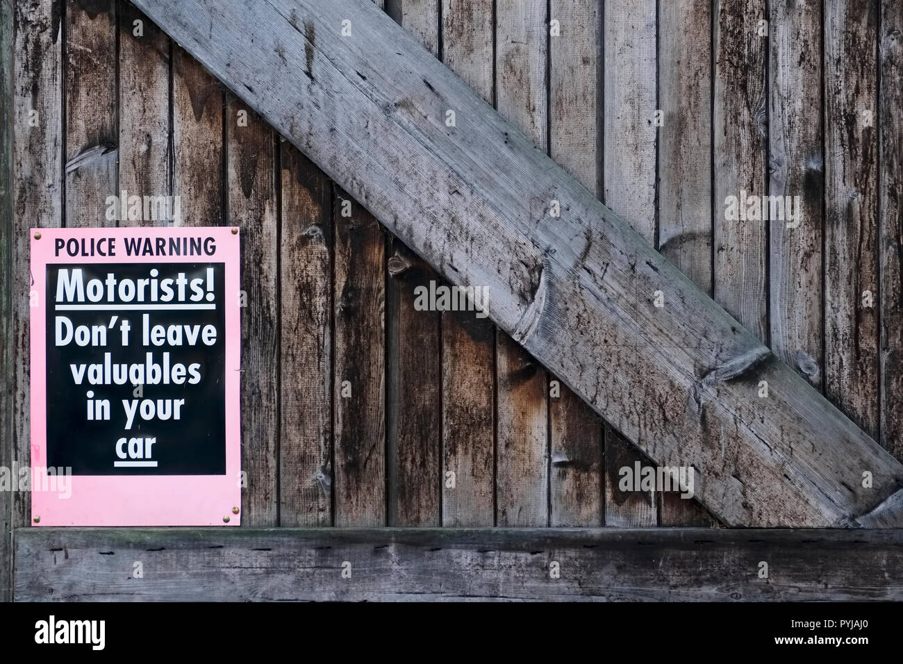 Motorists do not leave valuables in car police notice sign Stock Photo ...