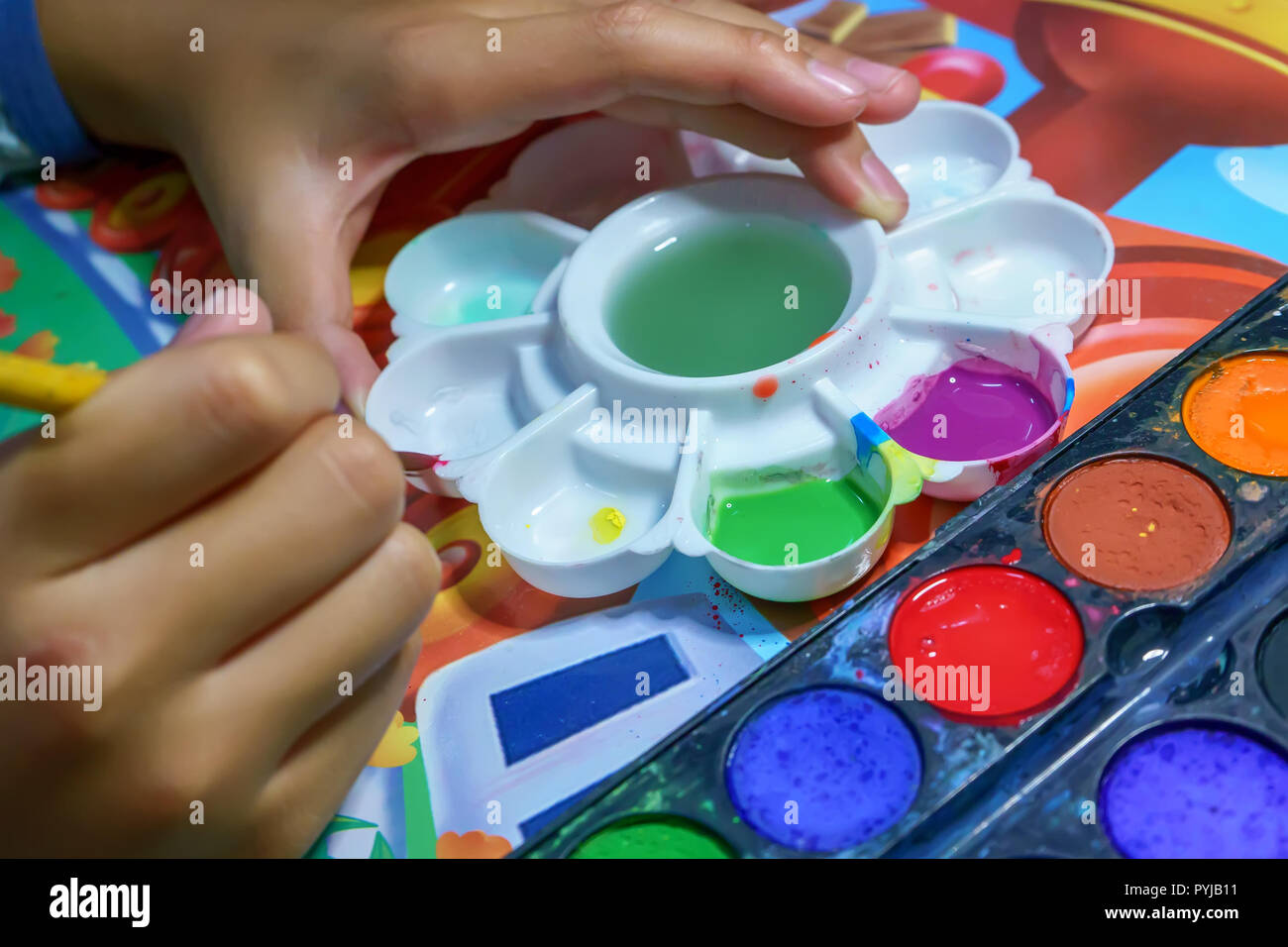 The children are learning to mix colors. It is homework Stock Photo - Alamy