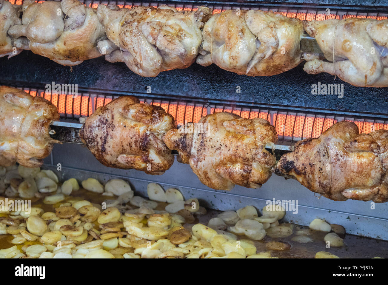 Spit roasted chickens hi-res stock photography and images - Alamy