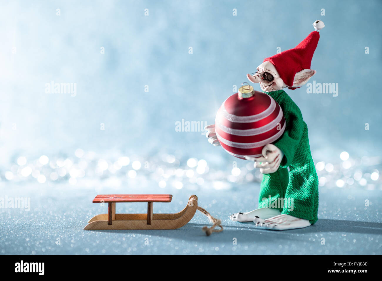 Cute Cheerful Santas Helper Elf Loading Christmas Bauble Onto Santas ...