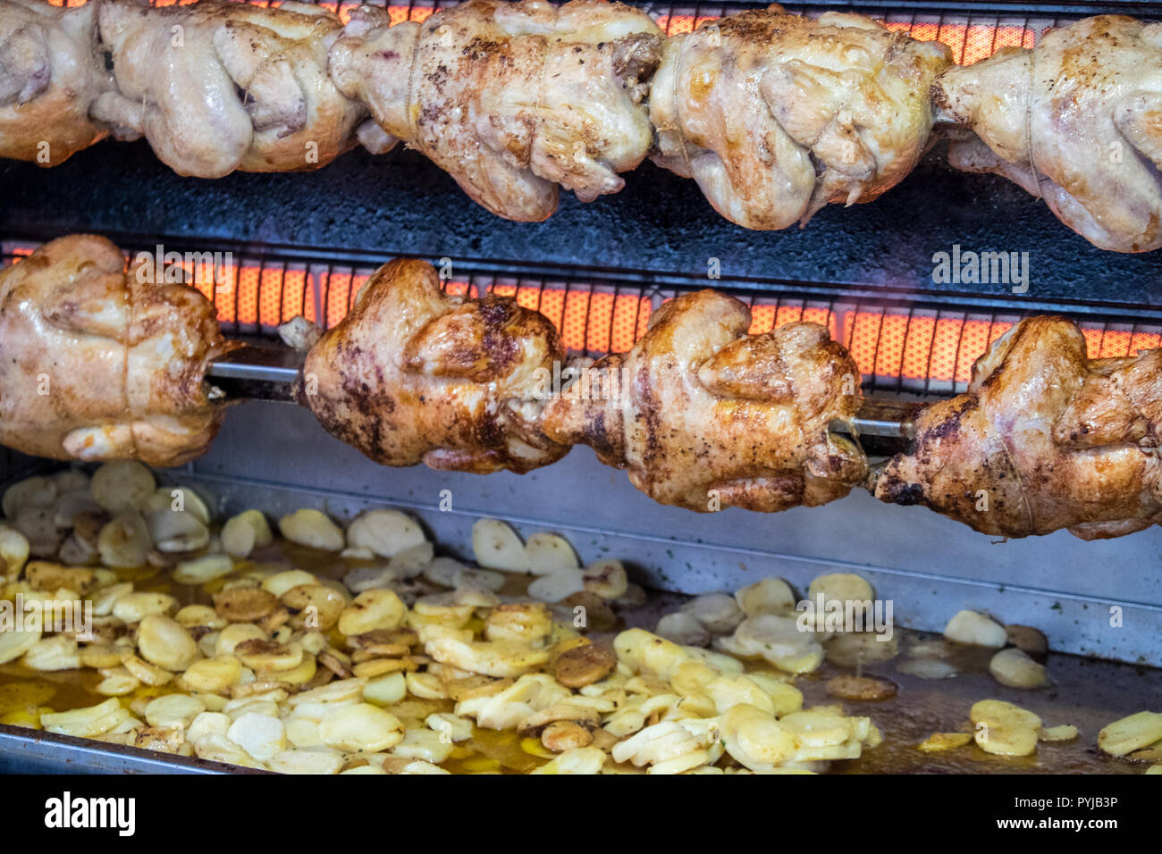 Spit roasted chickens hi-res stock photography and images - Alamy
