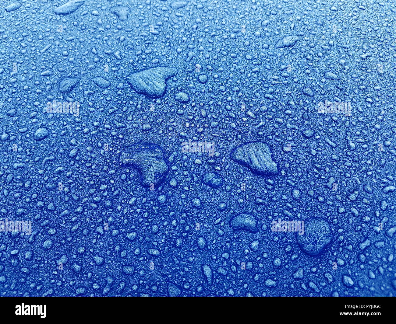 Frozen Water Droplets on a Frosted Metallic Background Stock Photo - Alamy