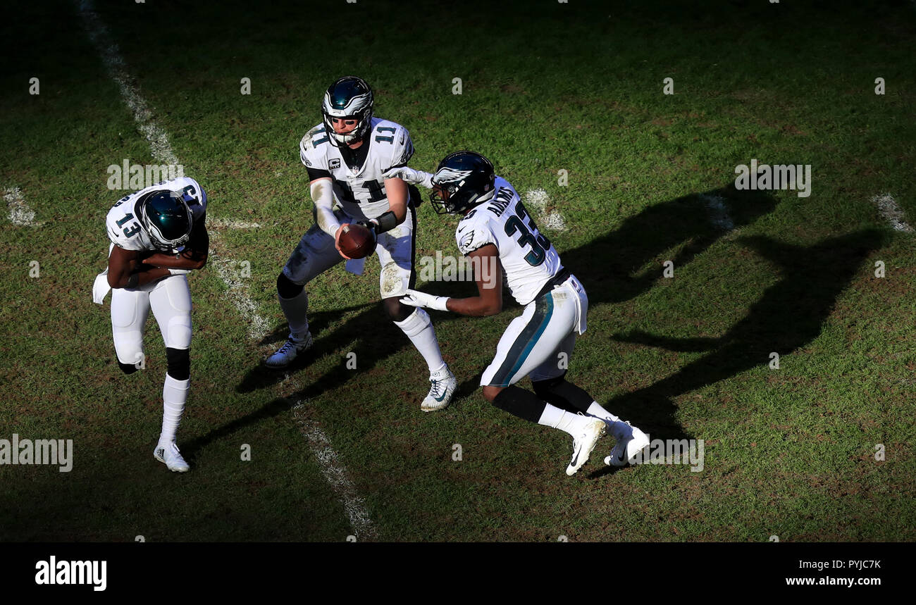 Philadelphia Eagles' Carson Wentz (centre) hands the ball off to Josh ...