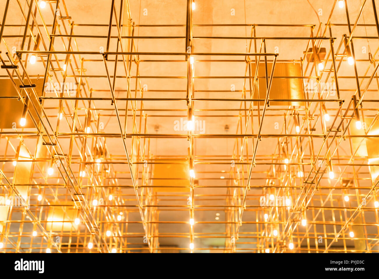 Modern metal lighting construction on the ceiling that looks like ...