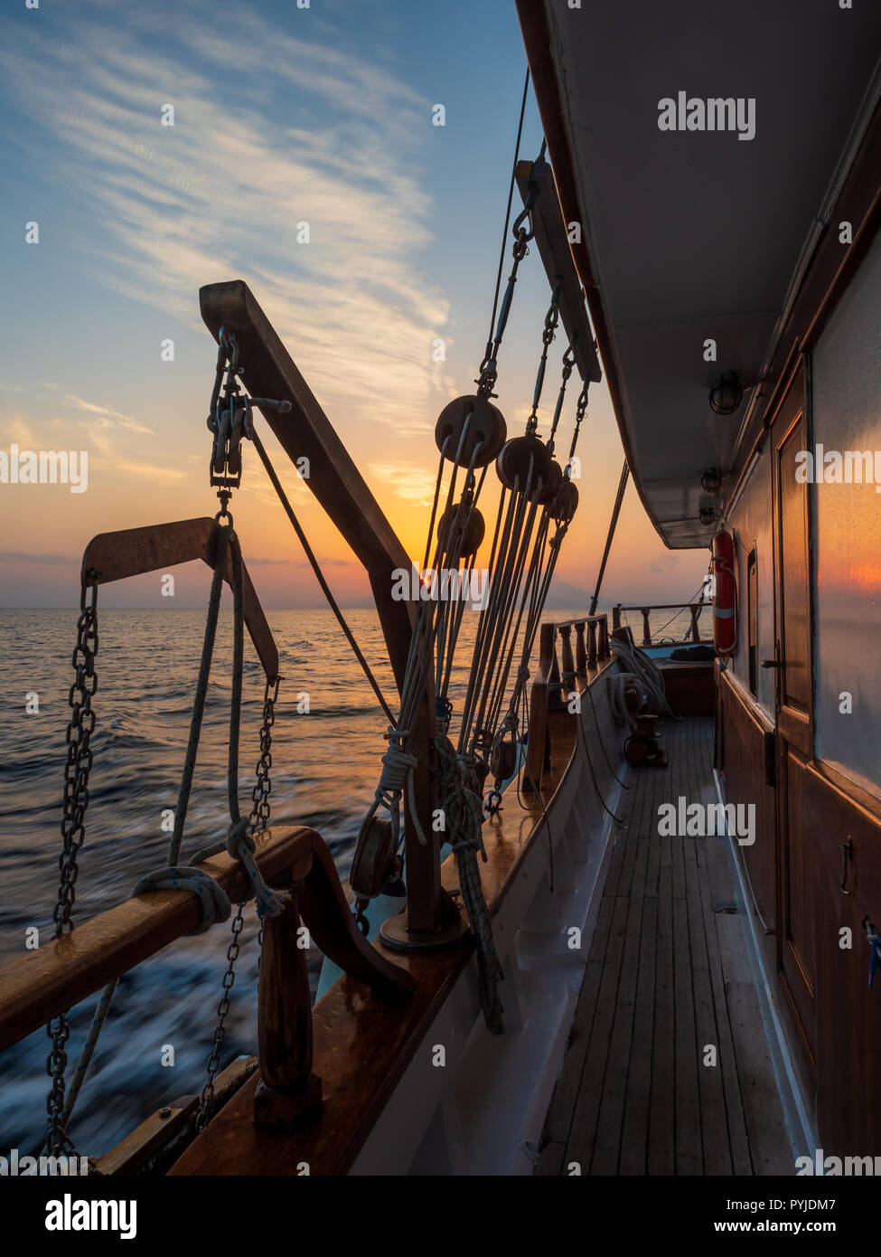 Sunset at the Sailboat deck while cruising in the Cyclades in Greece ...