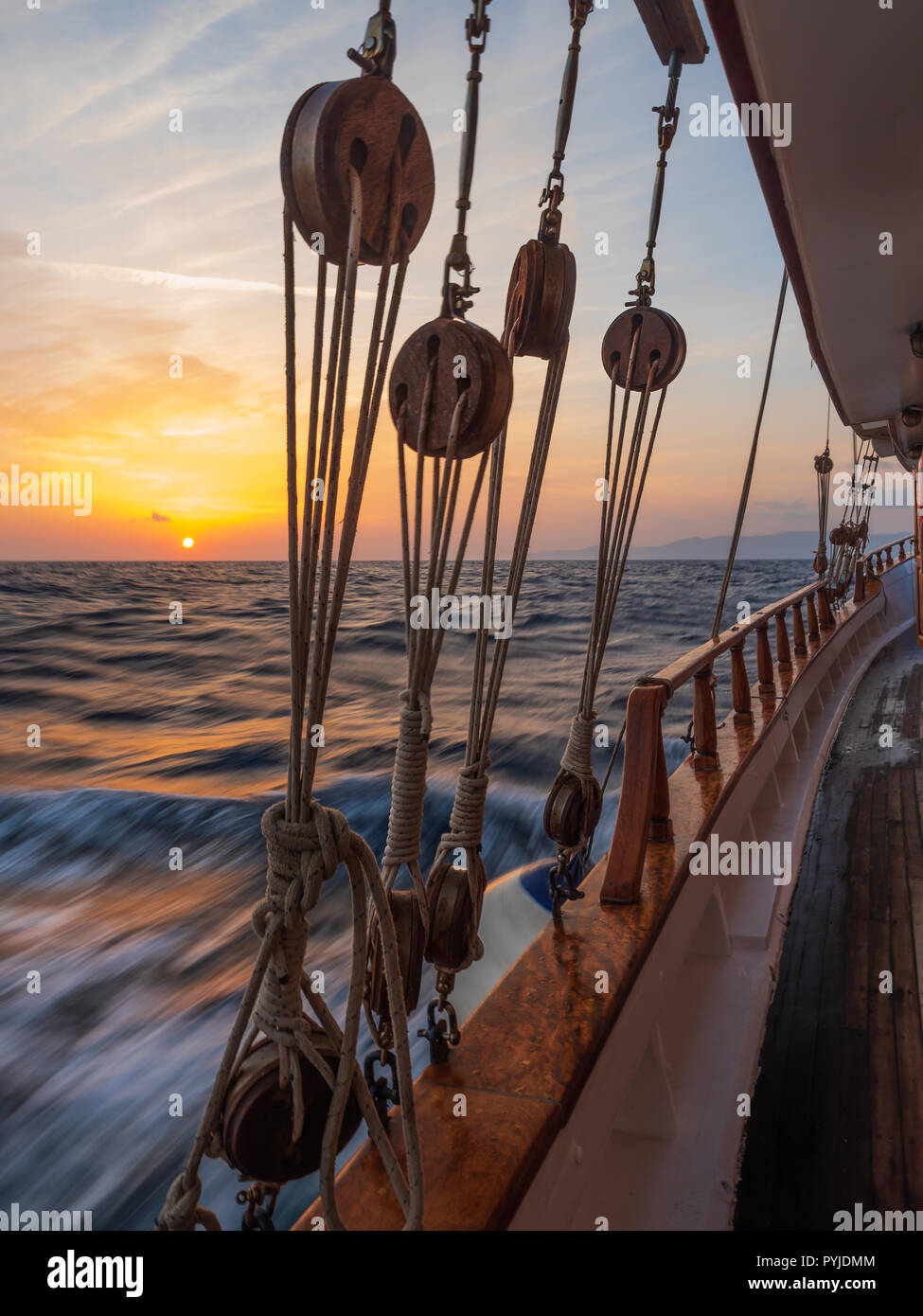 Sunset at the Sailboat deck while cruising in the Cyclades in Greece ...
