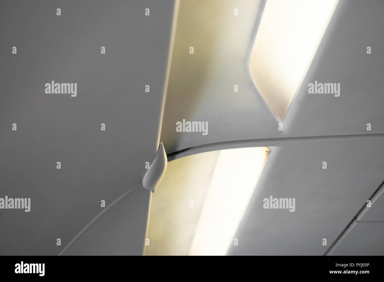 Lights and water diffusers in plane cockpit over the passengers seats ...