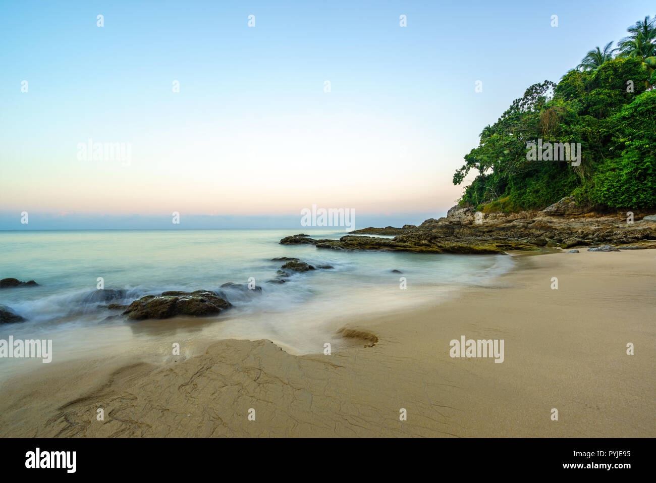 Beautiful Tropical beach at sunset at summer resort Stock Photo - Alamy