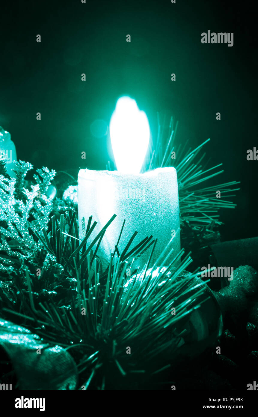 one burning candle image green light Stock Photo - Alamy