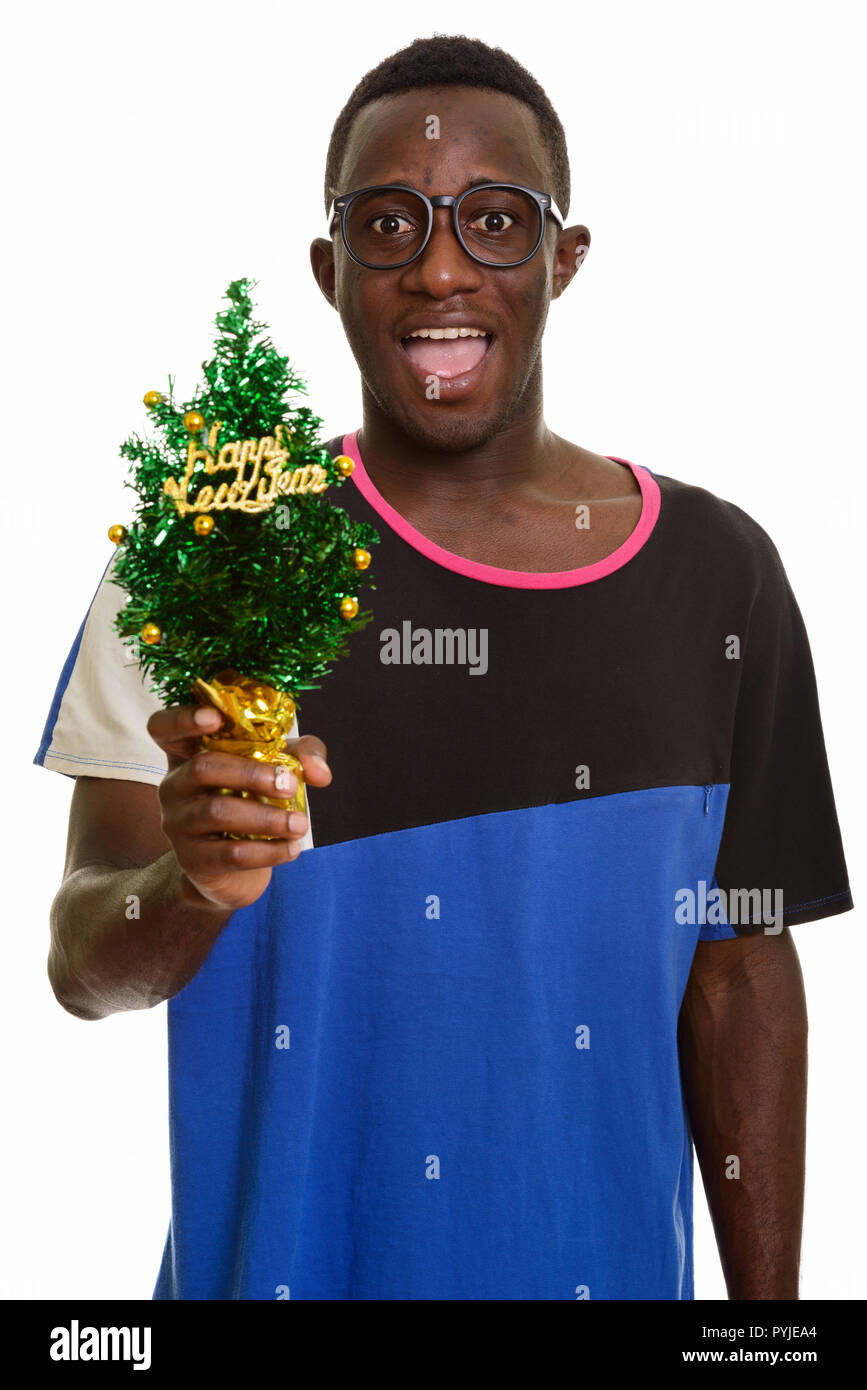 Happy African man smiling and looking excited while holding Happ Stock ...