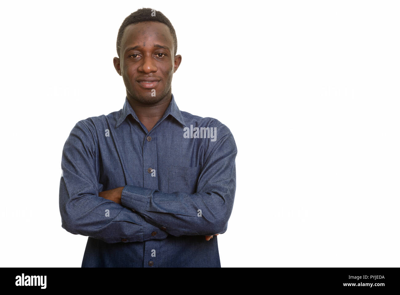 Young happy African man smiling with arms crossed Stock Photo - Alamy