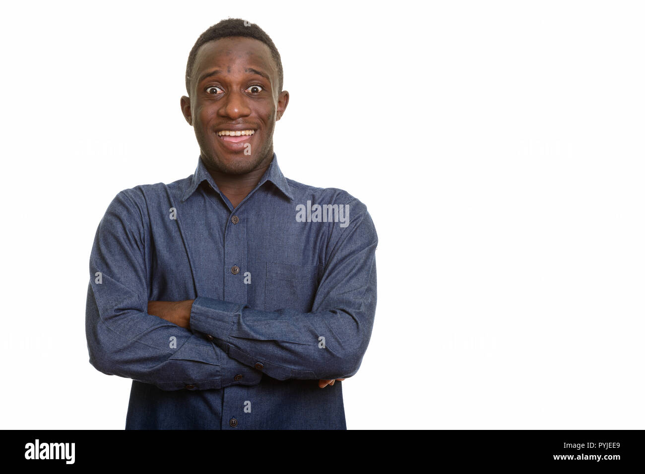 Young happy African man smiling and looking excited with arms cr Stock ...