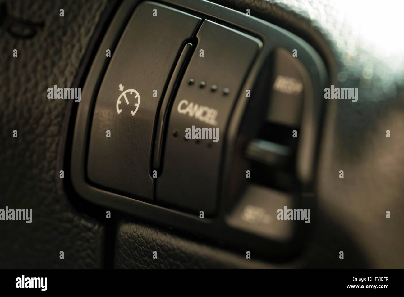 Cruise control unit in the new car close Stock Photo - Alamy