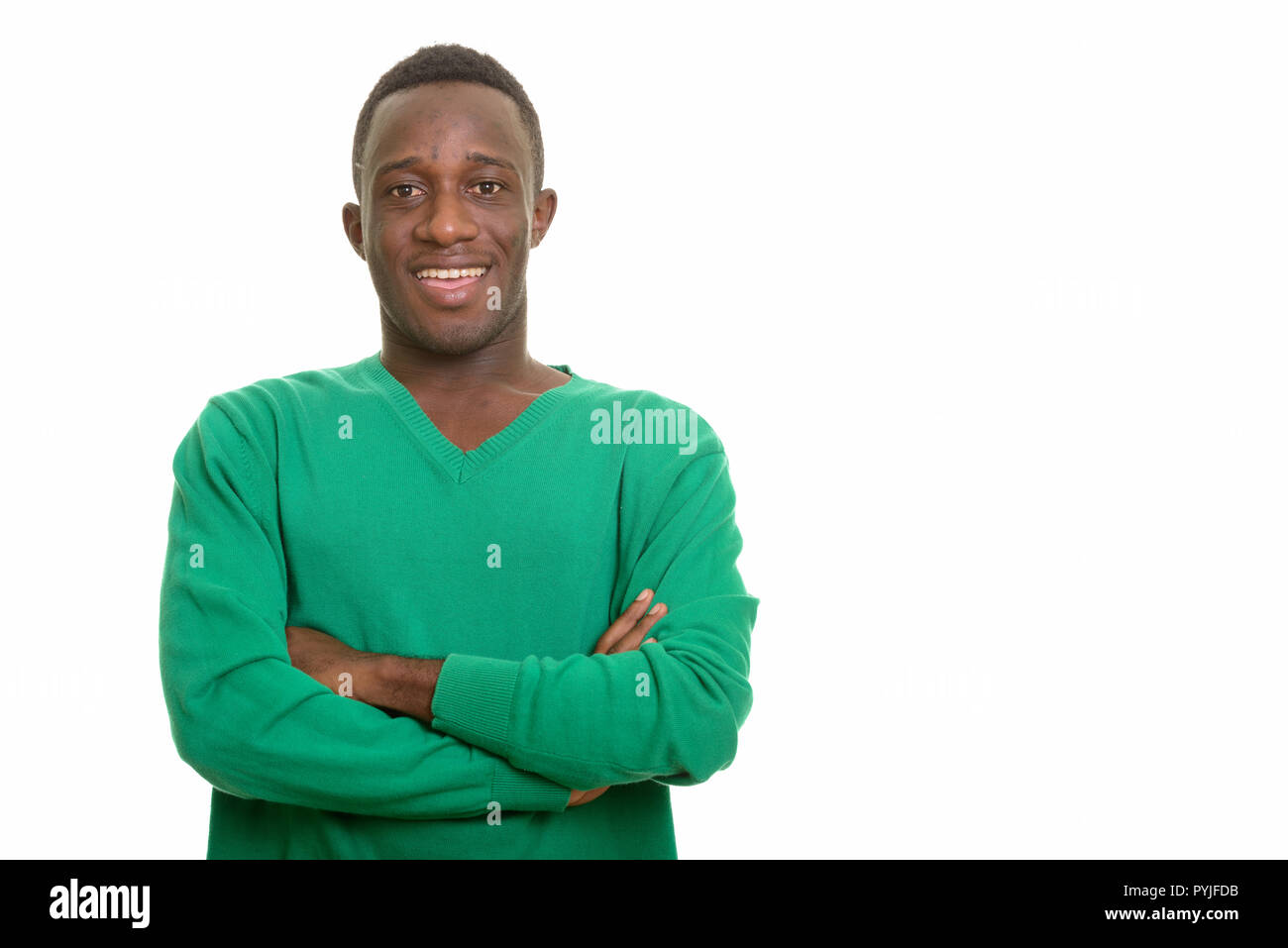 Young happy African man smiling with arms crossed Stock Photo - Alamy