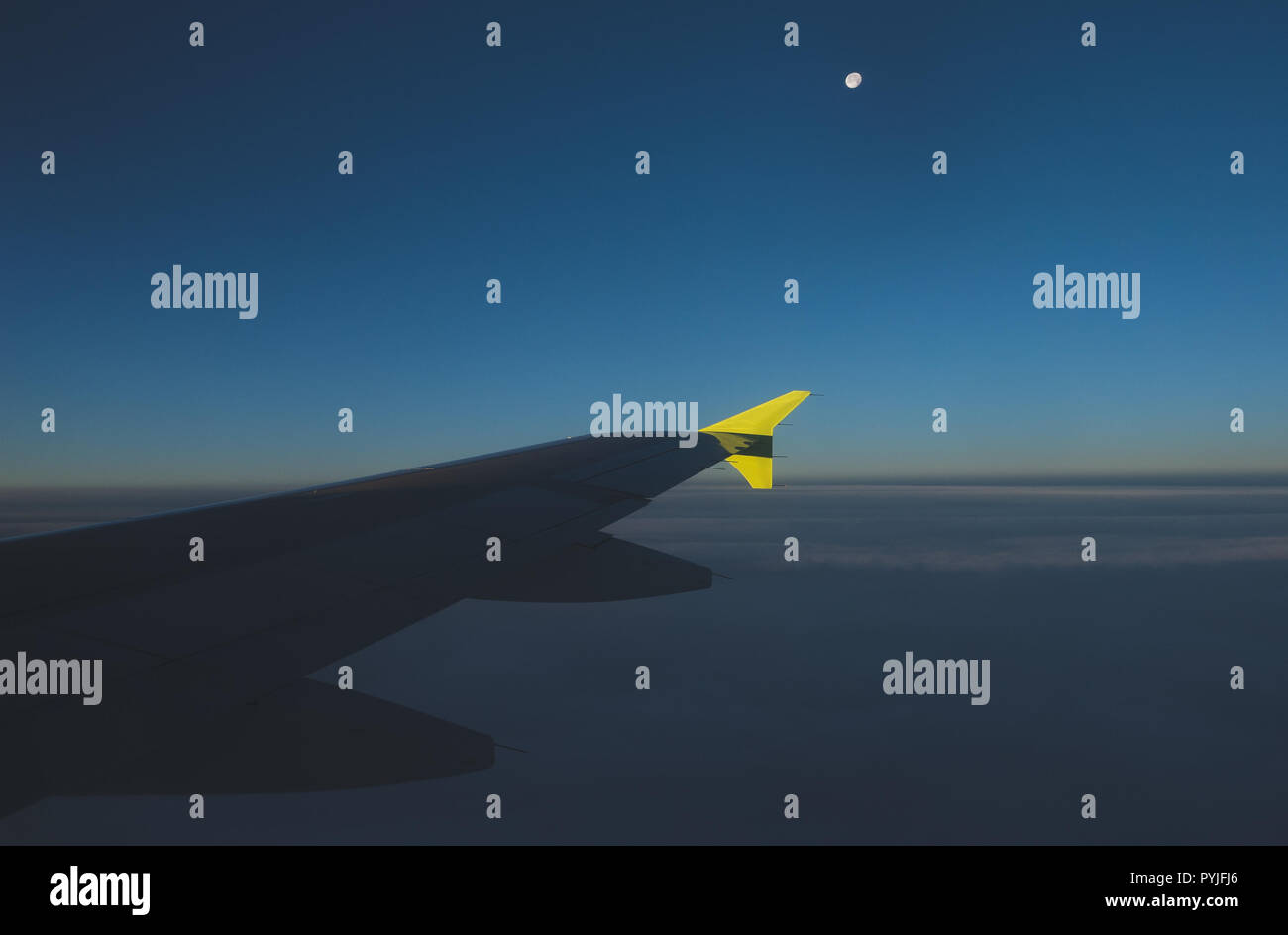 View of the moon and the wing from the window of a flying plane Stock ...