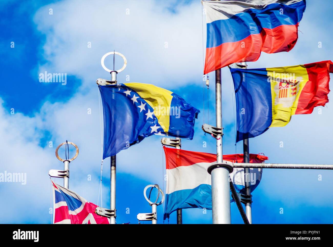 Flags of European countries on flagpoles against the blue sky Stock ...