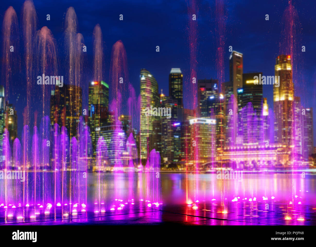 SIngapore water show with city skyline in background Stock Photo - Alamy