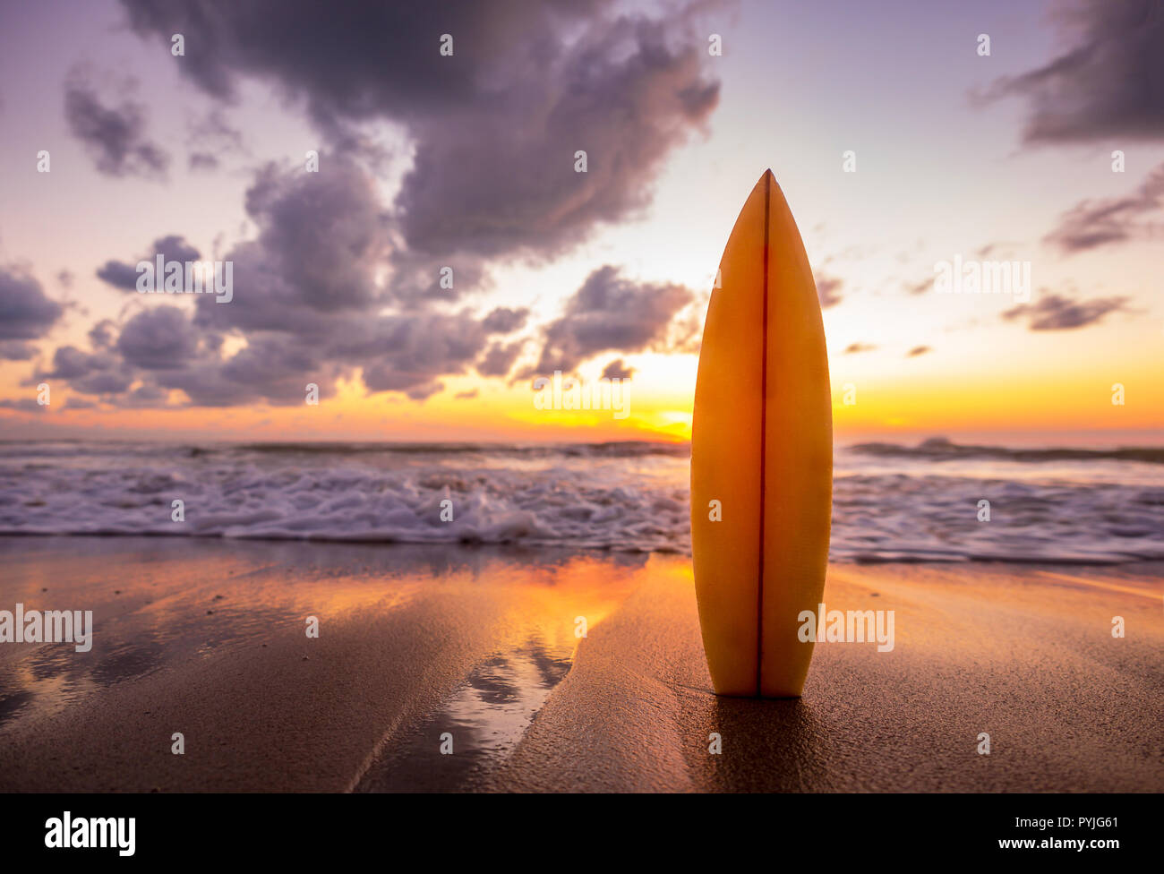 surfboard on the beach in sea shore at sunset time with beautiful light ...