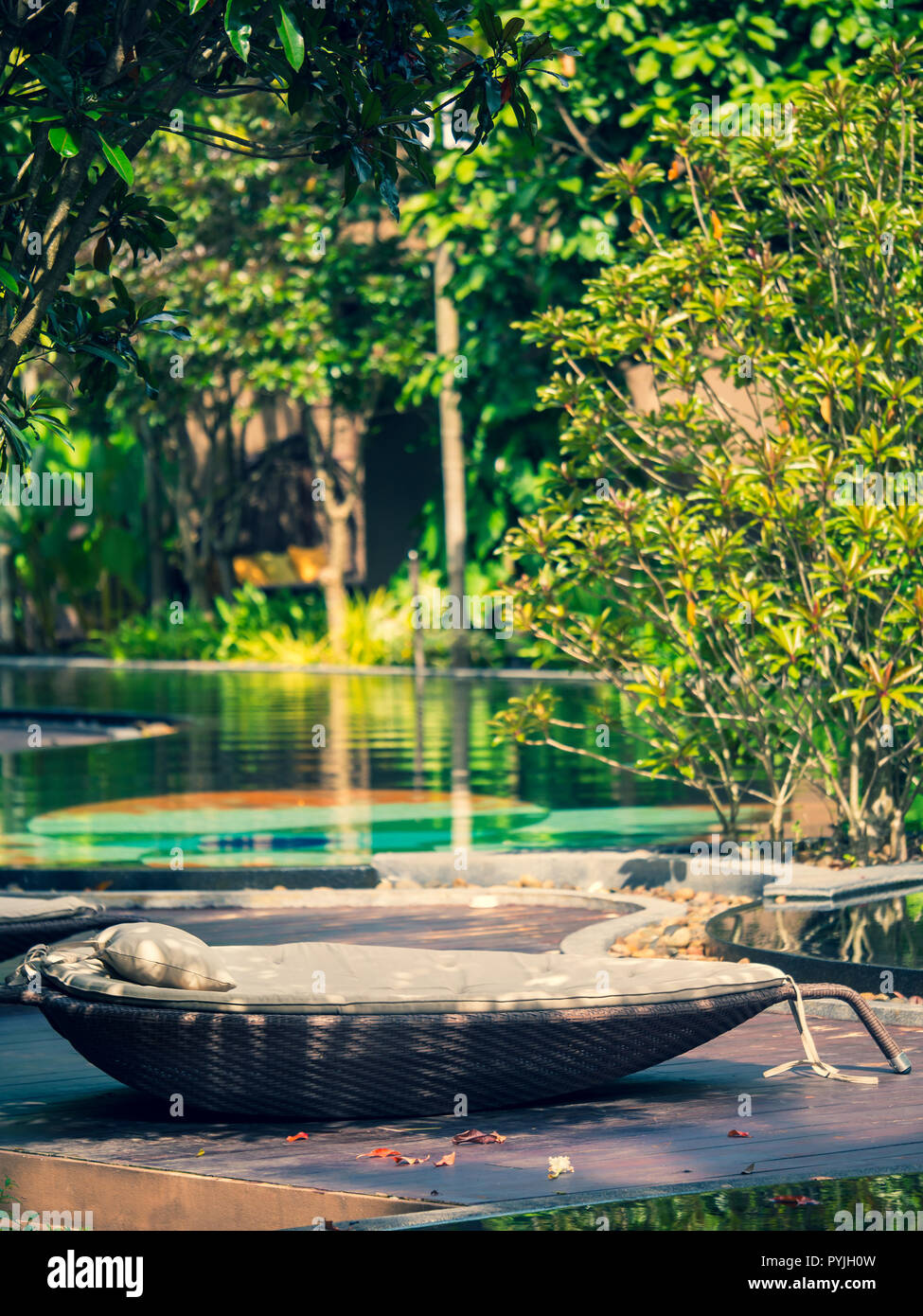 luxury swimming pool at tropical hotel resort, relaxing and leisure ...