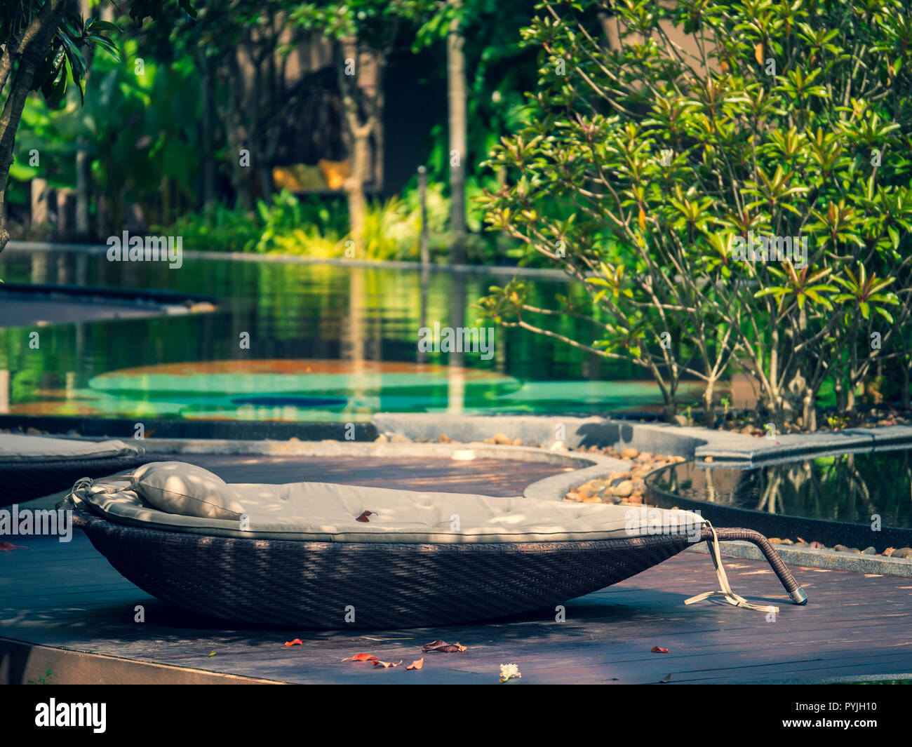 luxury swimming pool at tropical hotel resort, relaxing and leisure ...