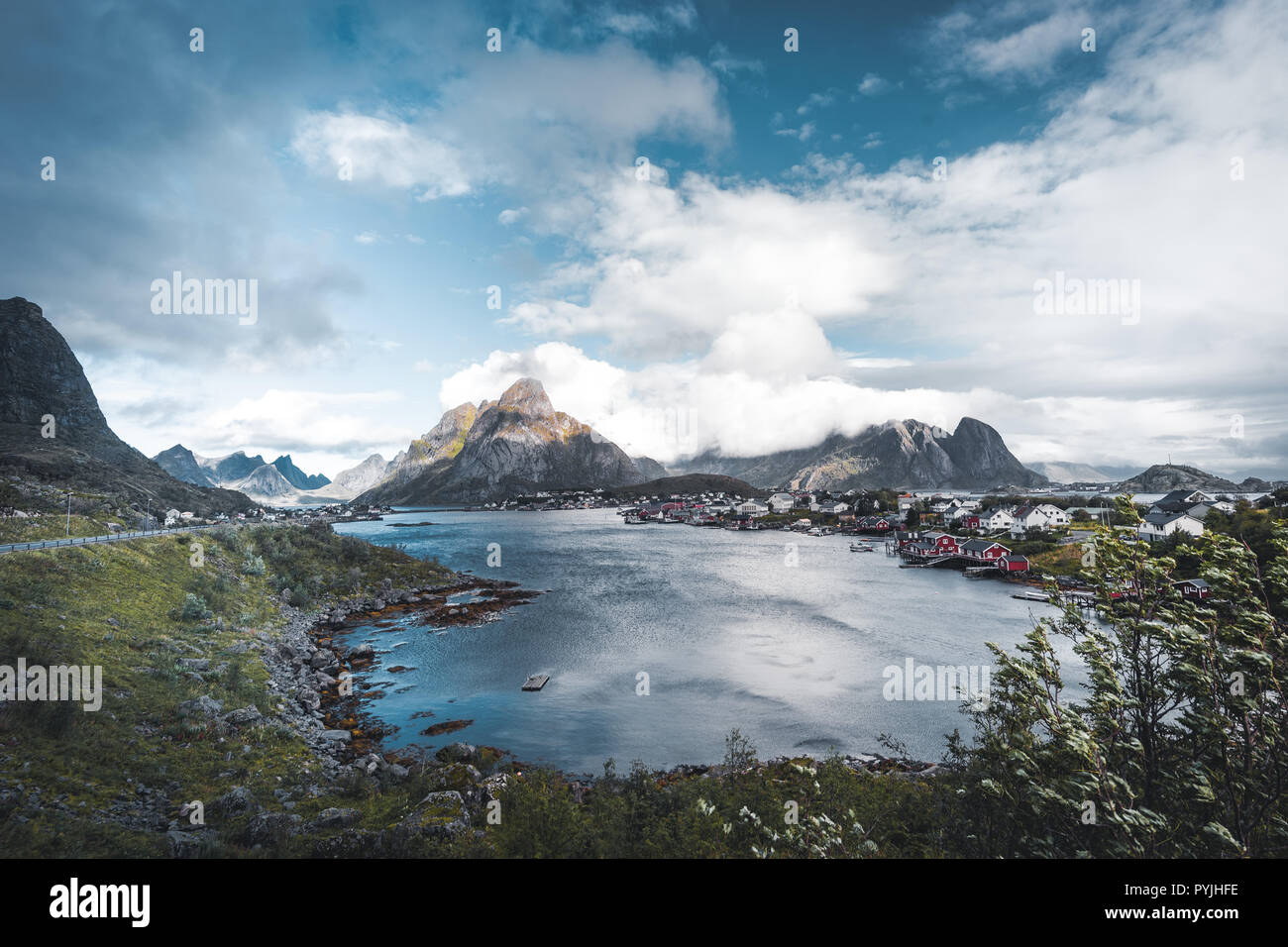 Landscape of fishing village Reine with the Reine Fjord during sunset ...