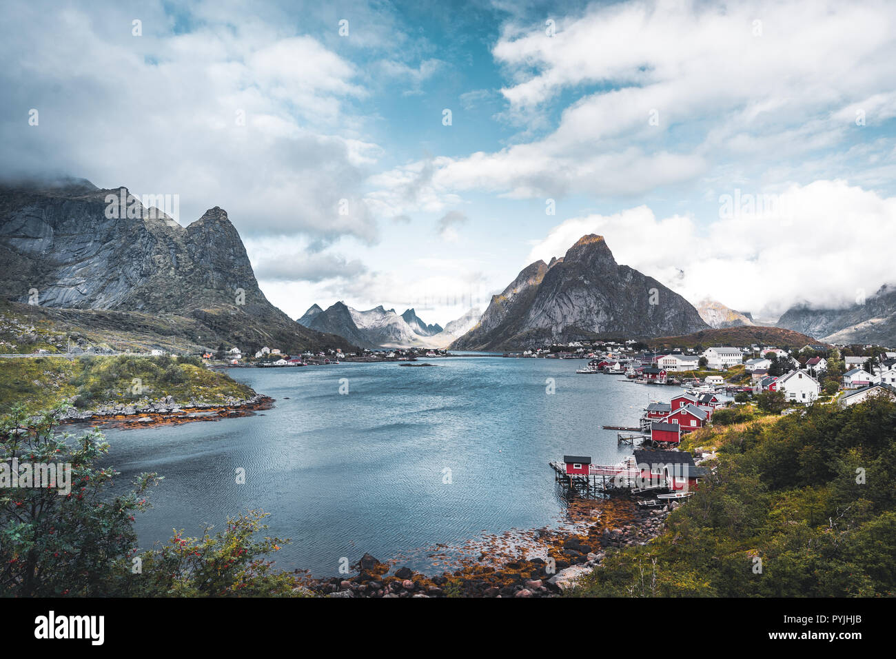 Landscape of fishing village Reine with the Reine Fjord during sunset ...