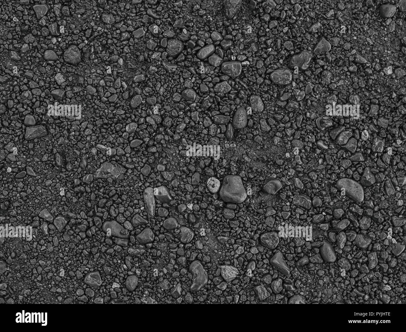 Icelandic black pebbles background Stock Photo - Alamy