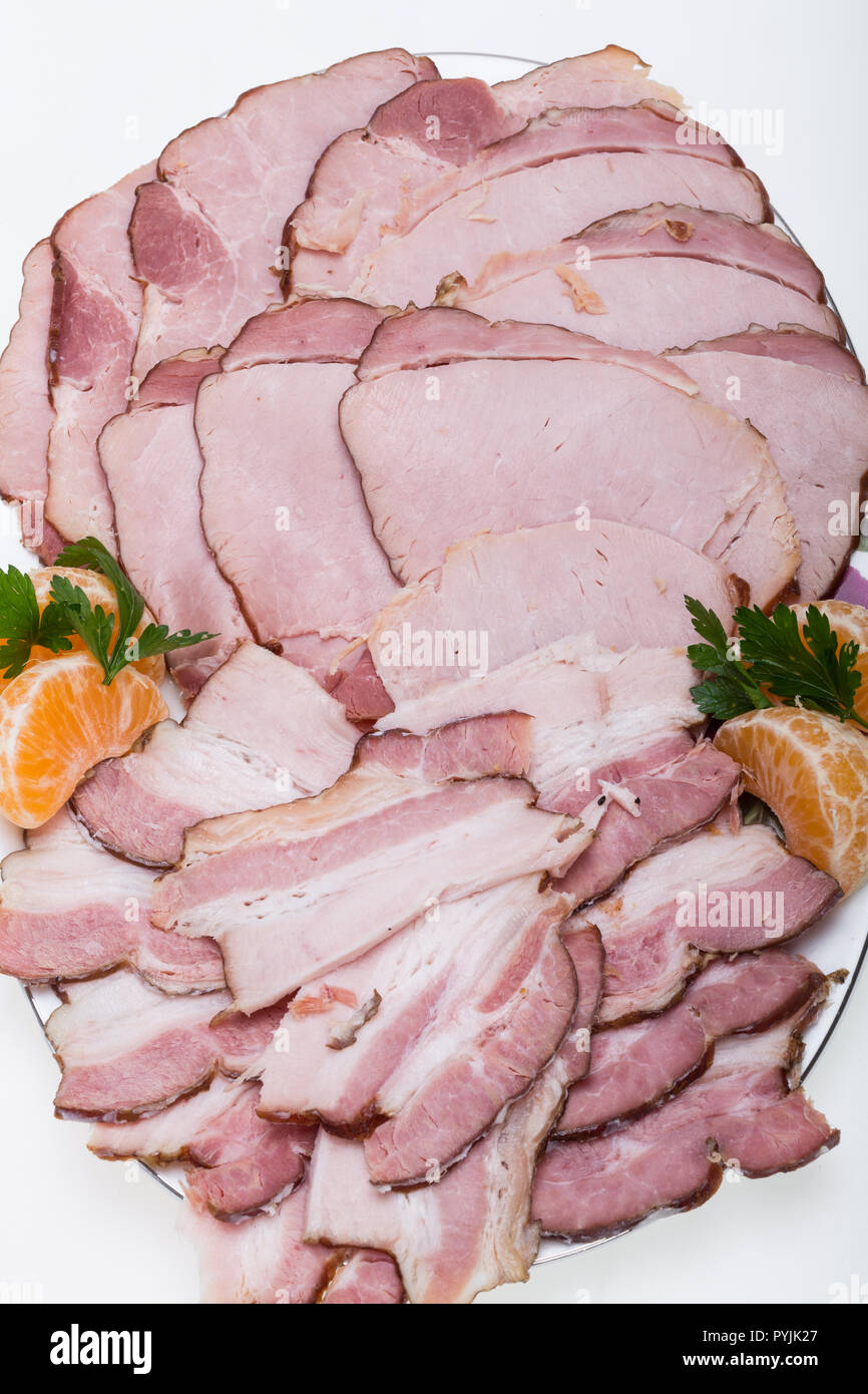 Plate of smoked meat isolated on white background Stock Photo - Alamy