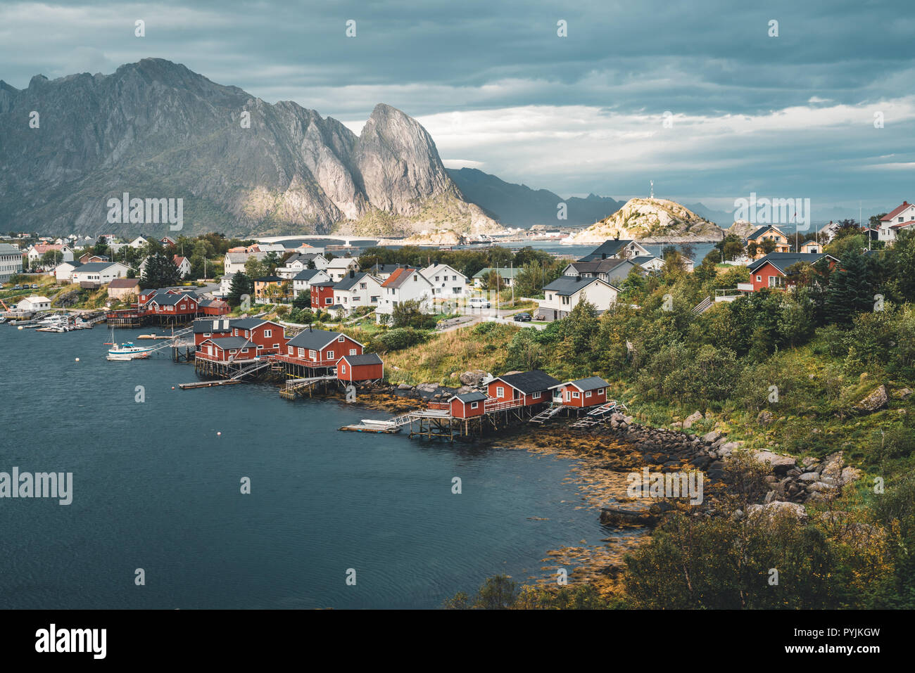 Landscape of fishing village Reine with the Reine Fjord during sunset ...
