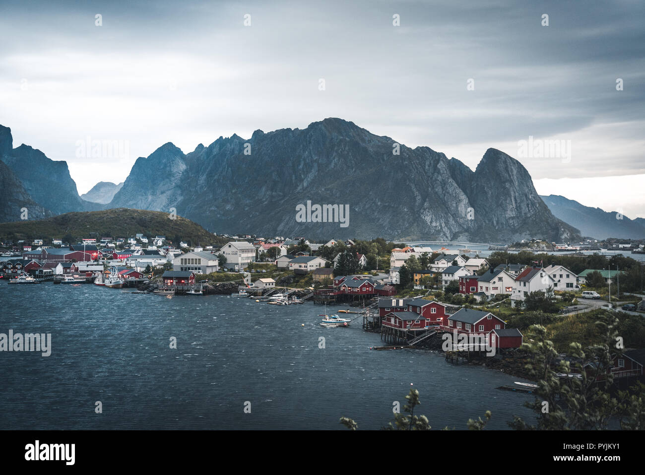 Landscape of fishing village Reine with the Reine Fjord during sunset ...