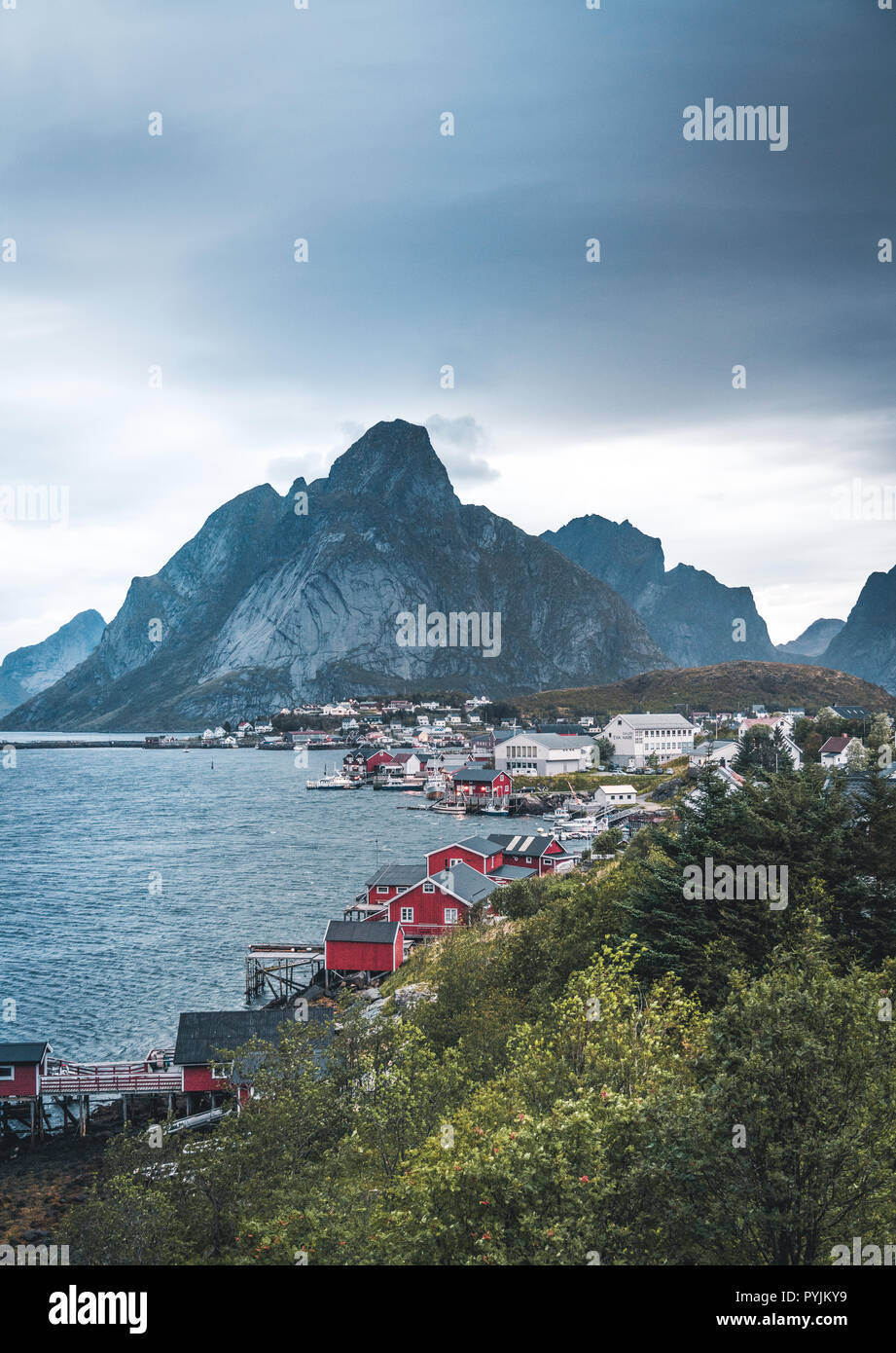 Landscape of fishing village Reine with the Reine Fjord during sunset ...