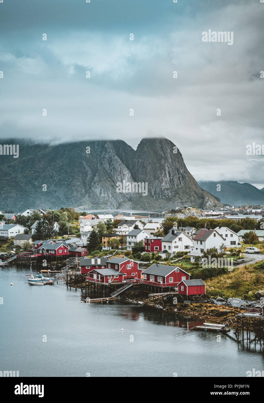 Landscape of fishing village Reine with the Reine Fjord during sunset ...